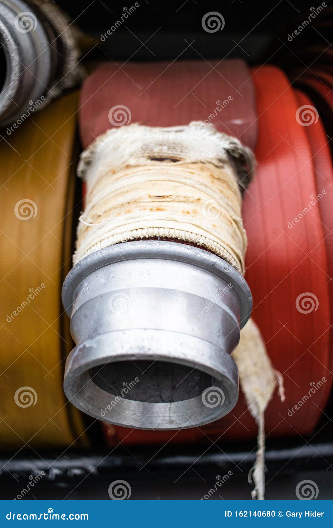 A Coiled Fire Hose on a Fire Engine Stock Photo - Image of hoses, tubes ...