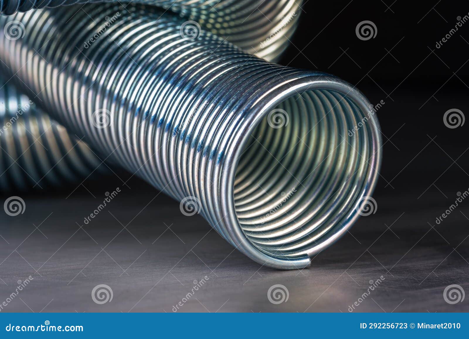 Coiled Metal Spring on Metal Surface Stock Image - Image of dark ...