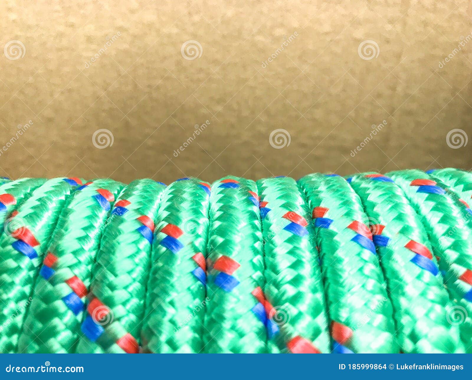 Coiled Nylon Rope Close Up Against Brown Cardboard Stock Photo - Image ...