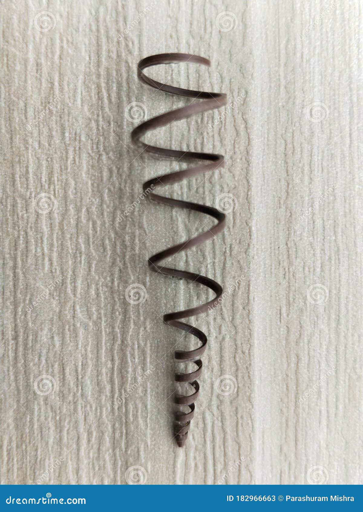 Coiled Plastic Material on Sunmica Stock Image - Image of coiled ...