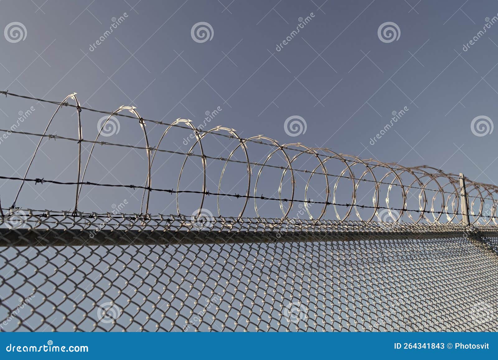 Coiled Razor Wire with Its Sharp Steel Barb. Ensuring Safety and ...
