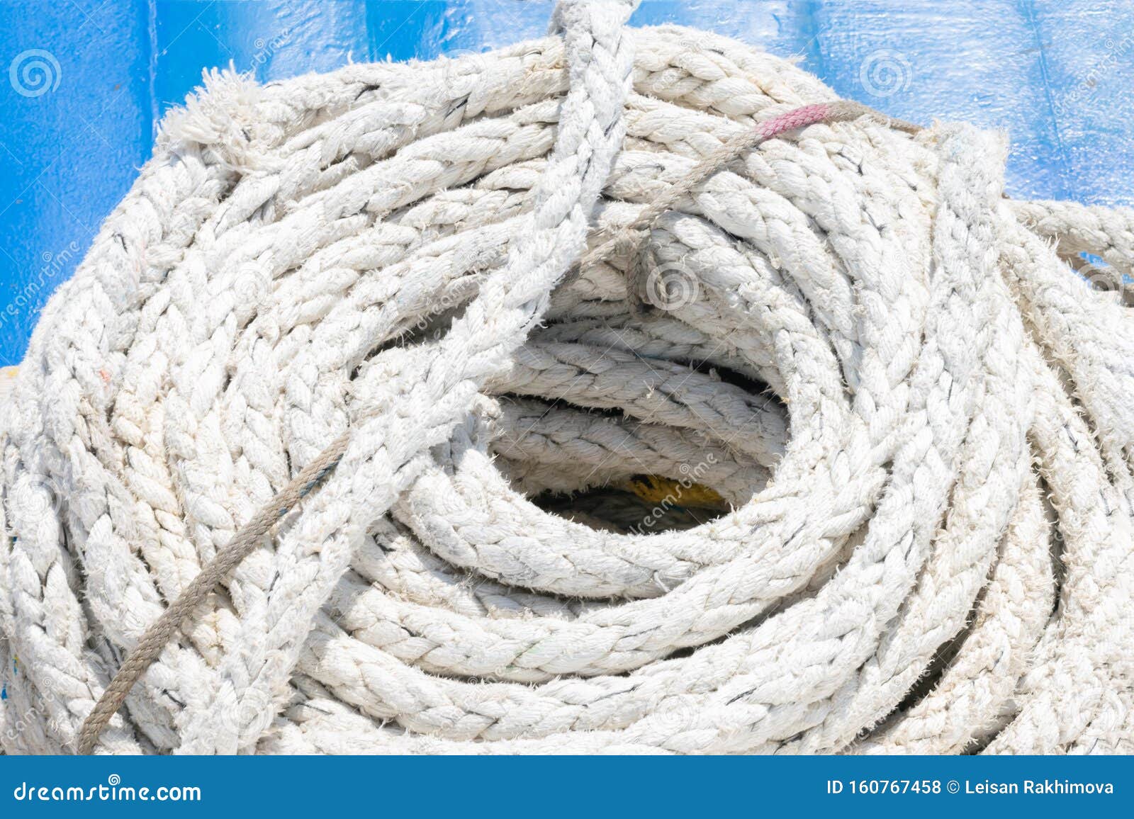 Spiral Ship Rope Lying Down On Dark Brown Deck As Background Texture ...