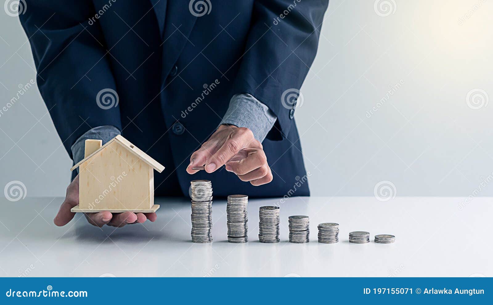 A Coin Cell with a Stack of Coins Lined Up Like a Graph and a House in ...