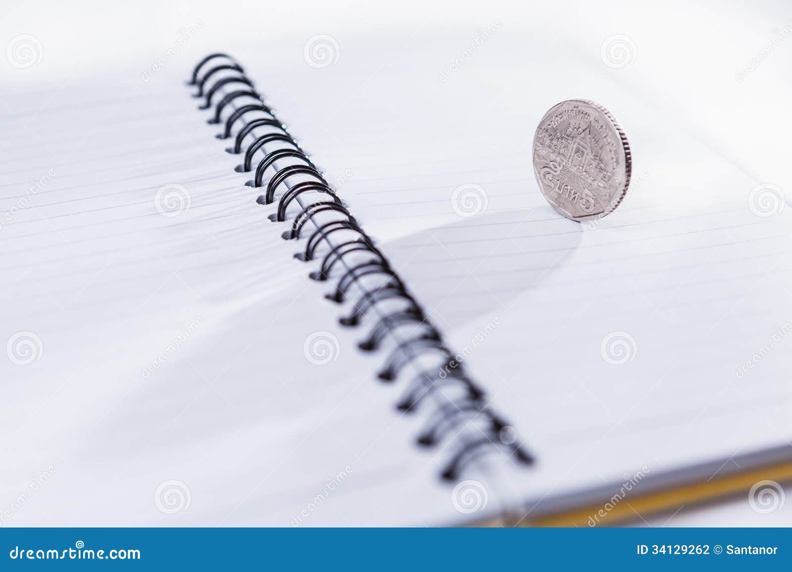 Coin on empty notebook stock photo. Image of stack, book - 34129262