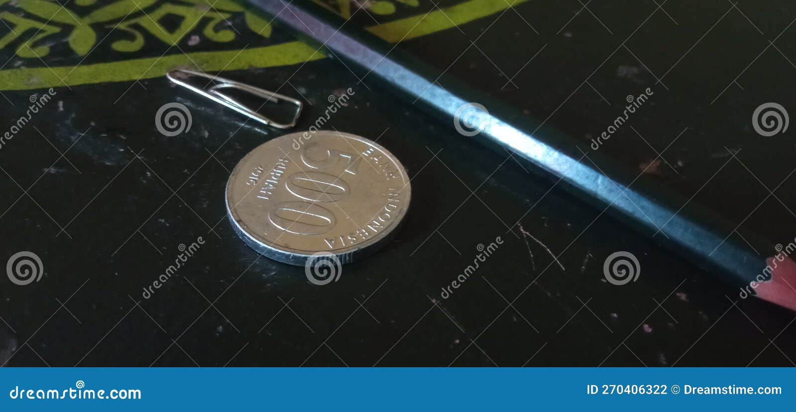 Coin, Paper Clip, Pencil,and Tabel Stock Photo - Image of clip, coin ...