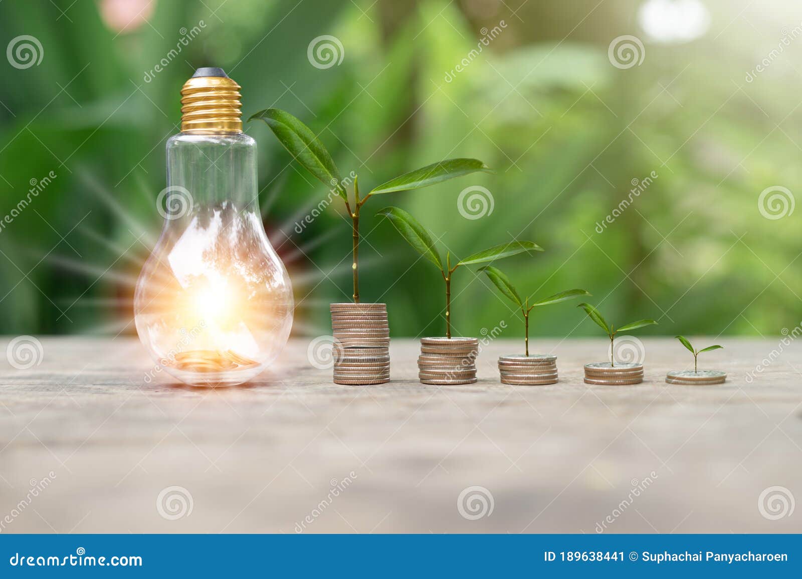 Coins Arranged in Graph Neatly Stack and Light Bulb with Coin Inside ...