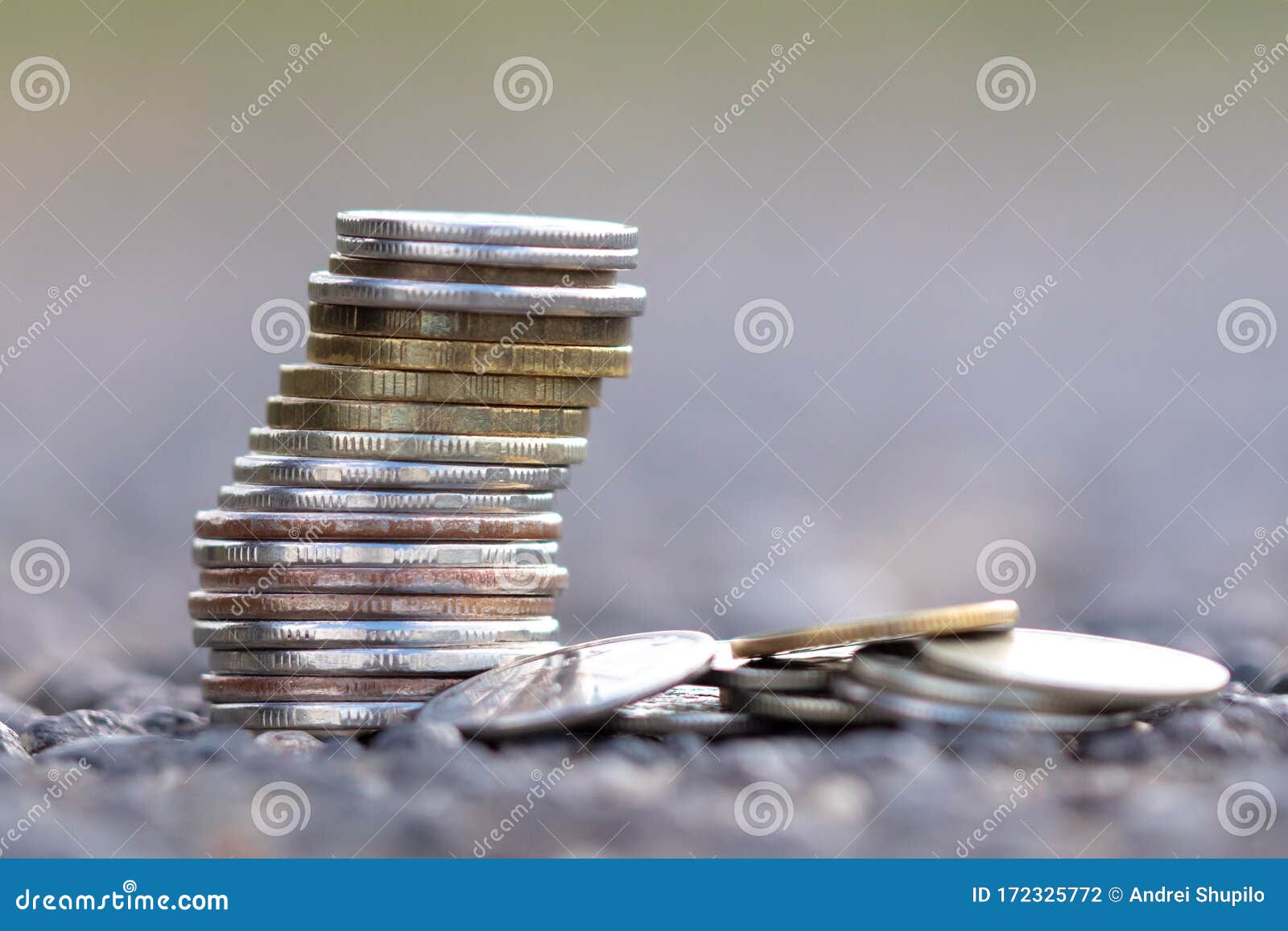 Coins on the asphalt road stock photo. Image of pavement - 172325772
