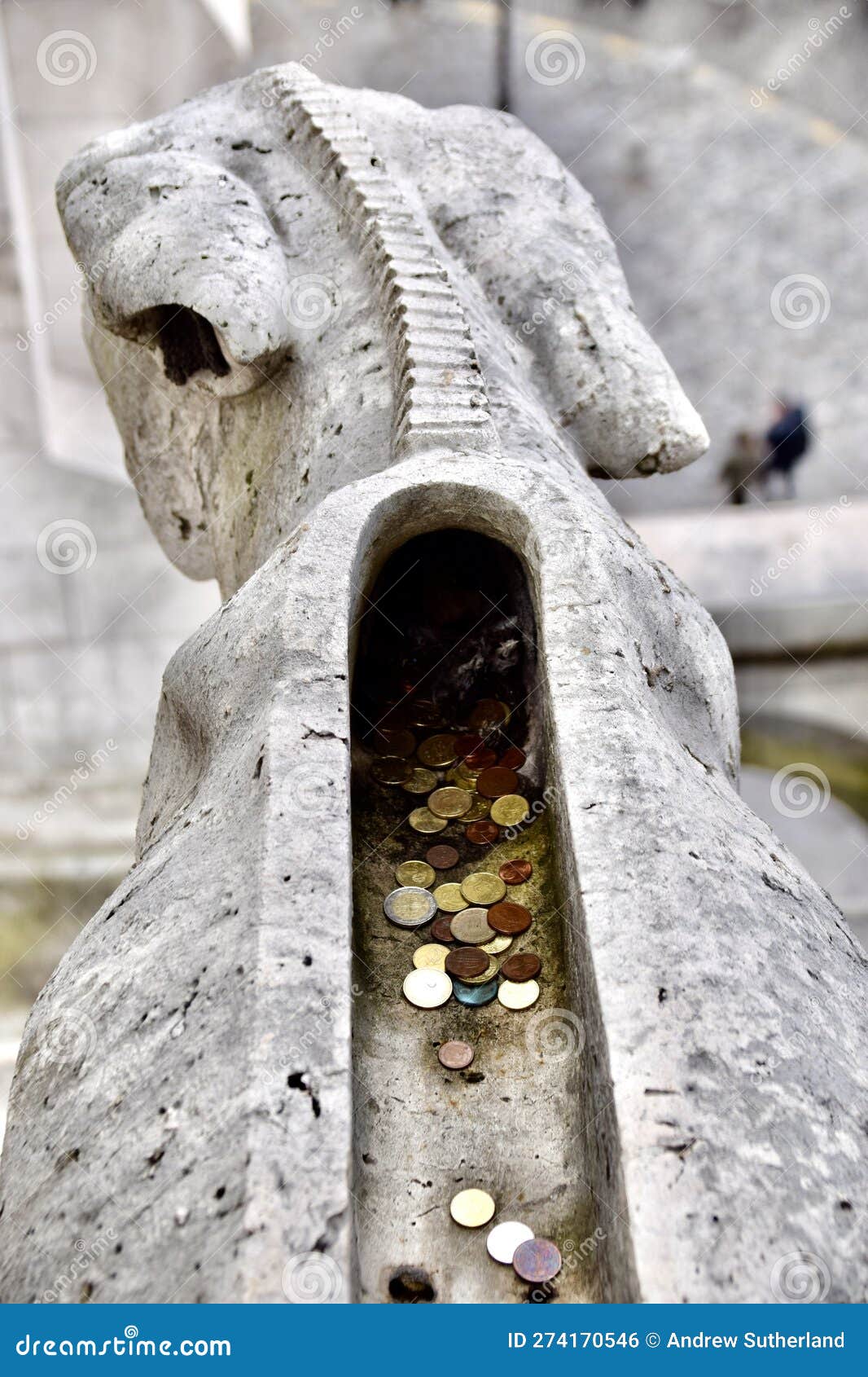 Coins in the Back of a White Stone Gargoyle. Stock Photo - Image of ...