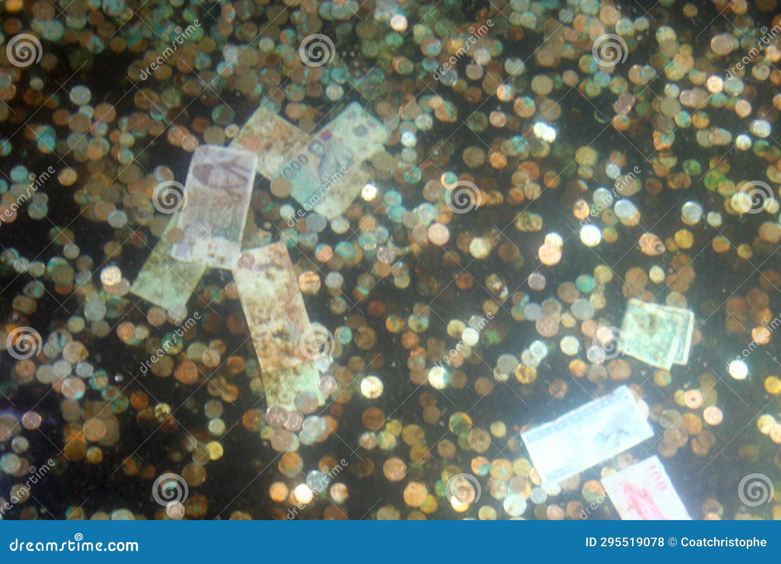 Coins and Banknotes at Bottom of a Wishing Well Stock Photo - Image of ...
