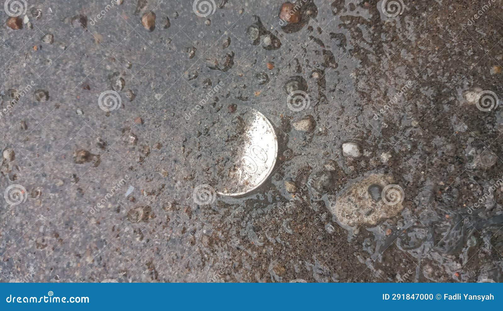 Coins Buried in Sand when it Rains Stock Photo - Image of coins, sand ...
