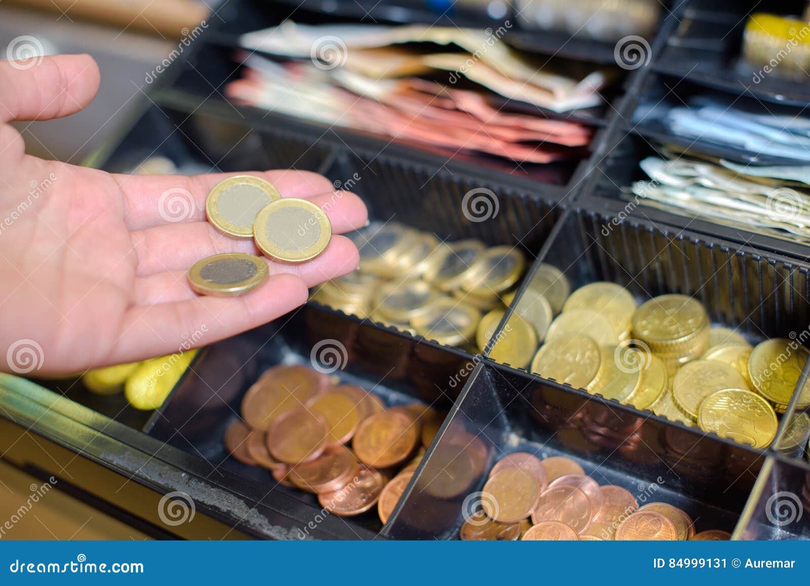 Coins in cash register stock image. Image of segregate - 84999131