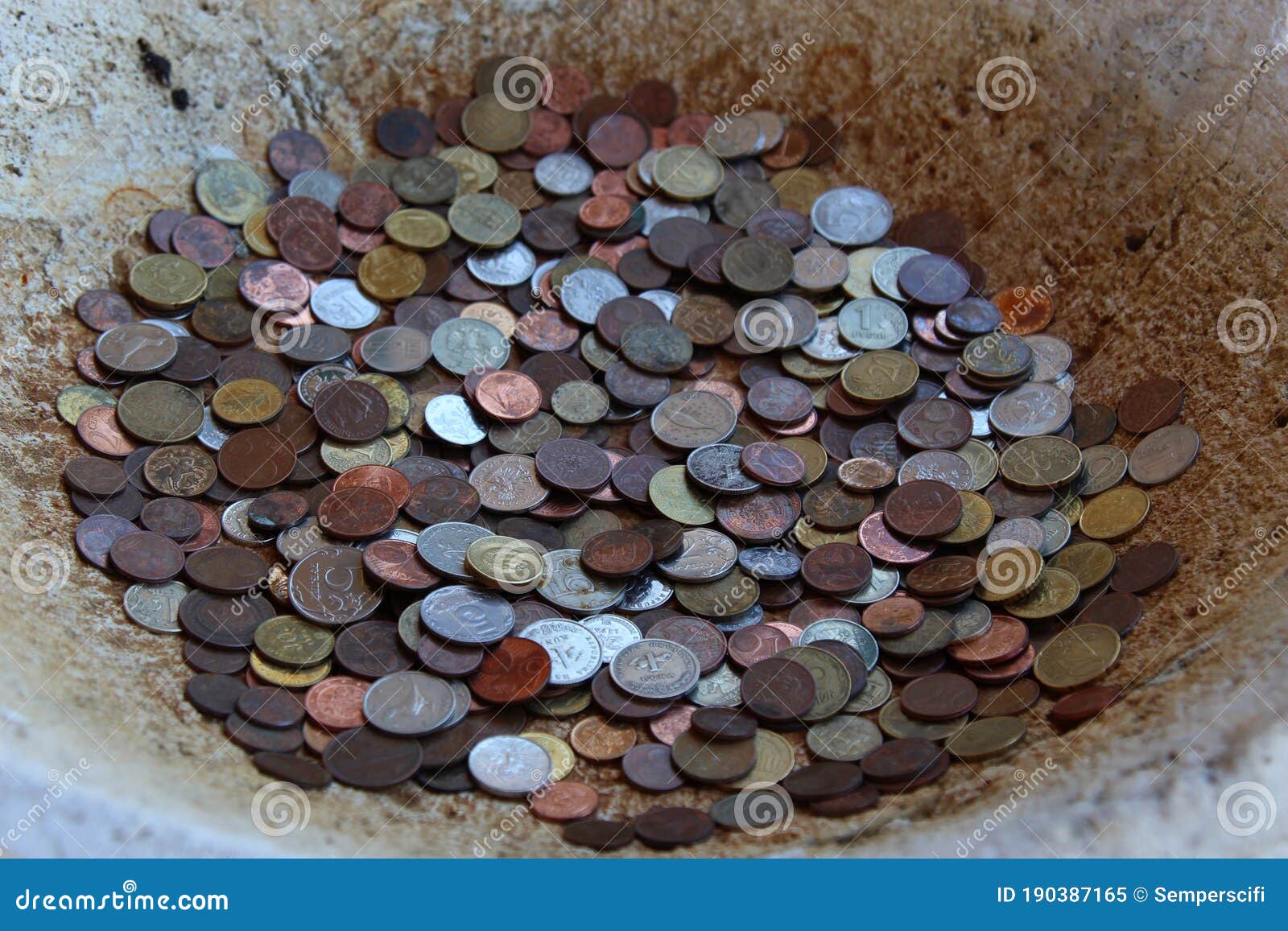 Coins of Different Countries in an Ancient Stone Bowl Stock Image ...