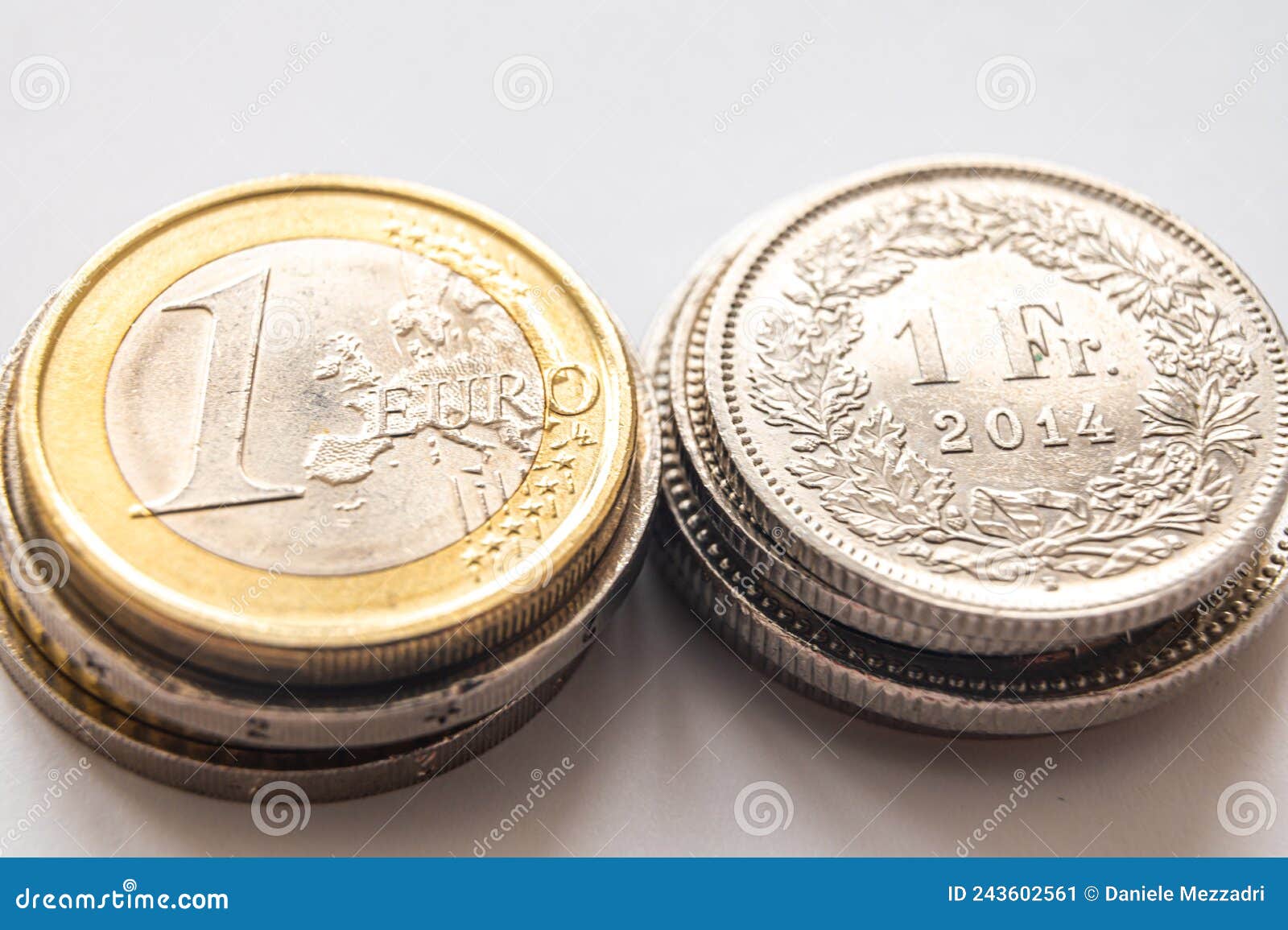 Coins of Euro and Swiss Franc. Conversion between Euro and CHF Stock ...
