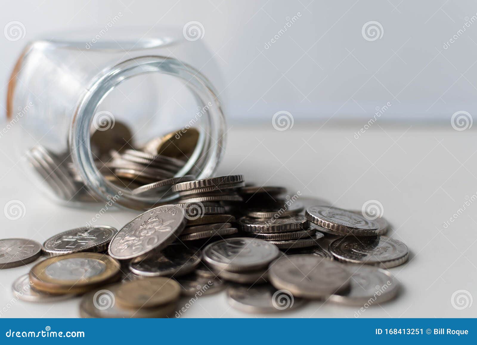 Coins in the Glass Bottle, Saving Money. Coins in a Jar Stock Image ...