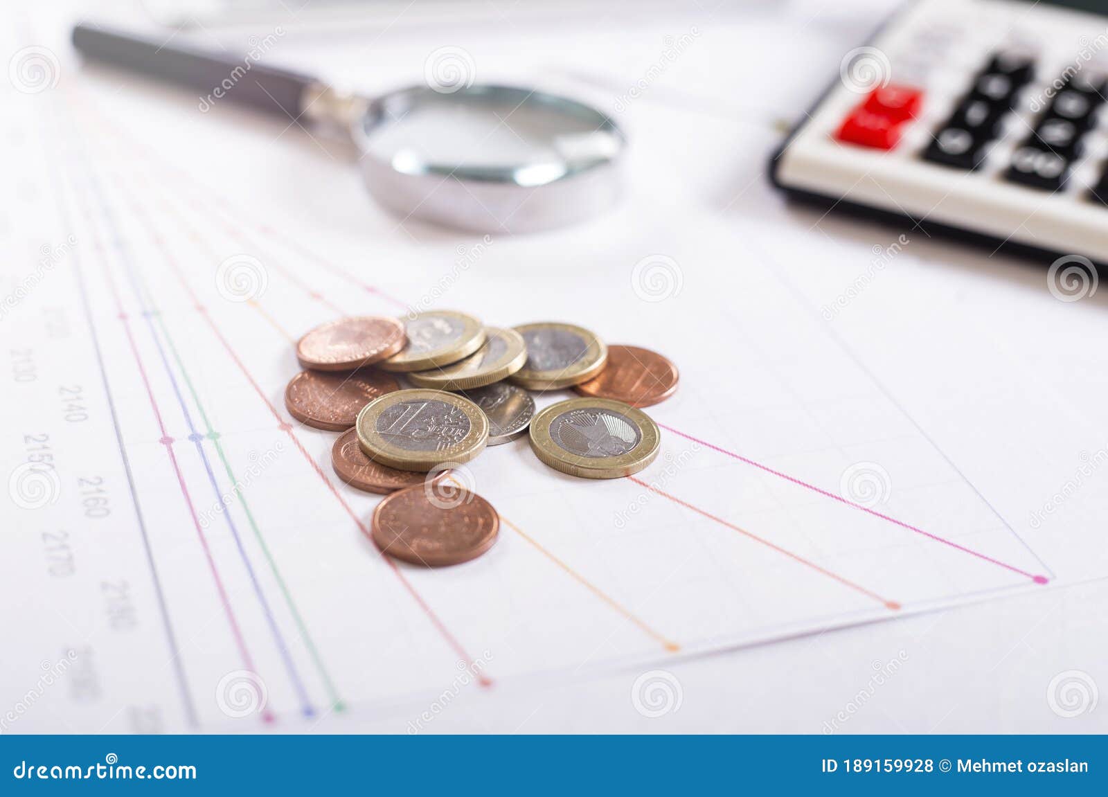 Coins and Magnifier on the Increase Graph Stock Photo - Image of ...