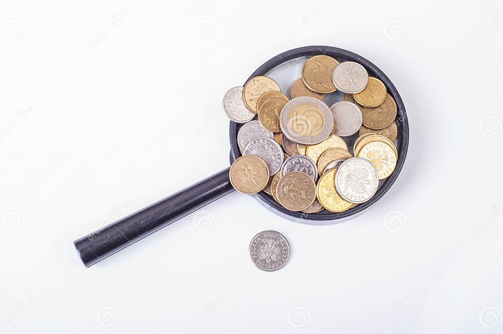 Coins on magnifying glass stock photo. Image of dime - 28335812