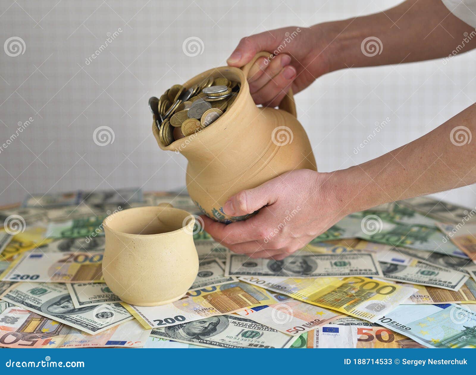Coins Pour Out of a Jug into a Cup Stock Image - Image of accounting ...