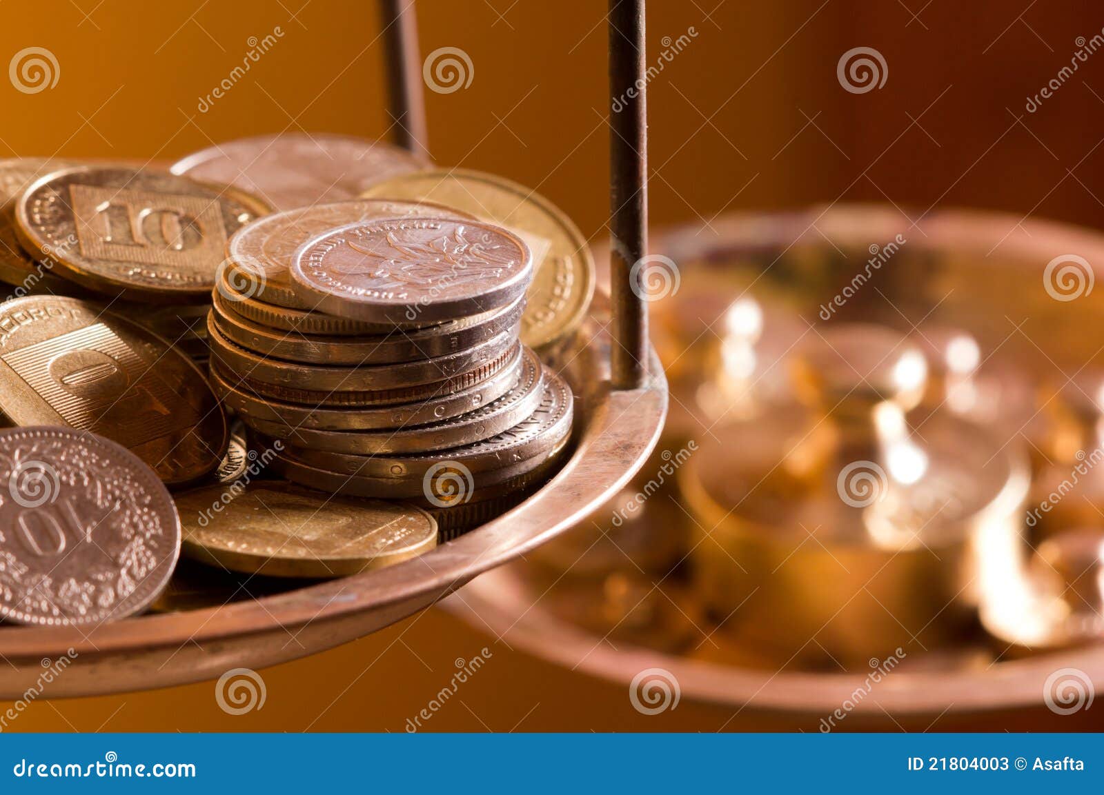 Coins on a scale weight stock image. Image of finance - 21804003