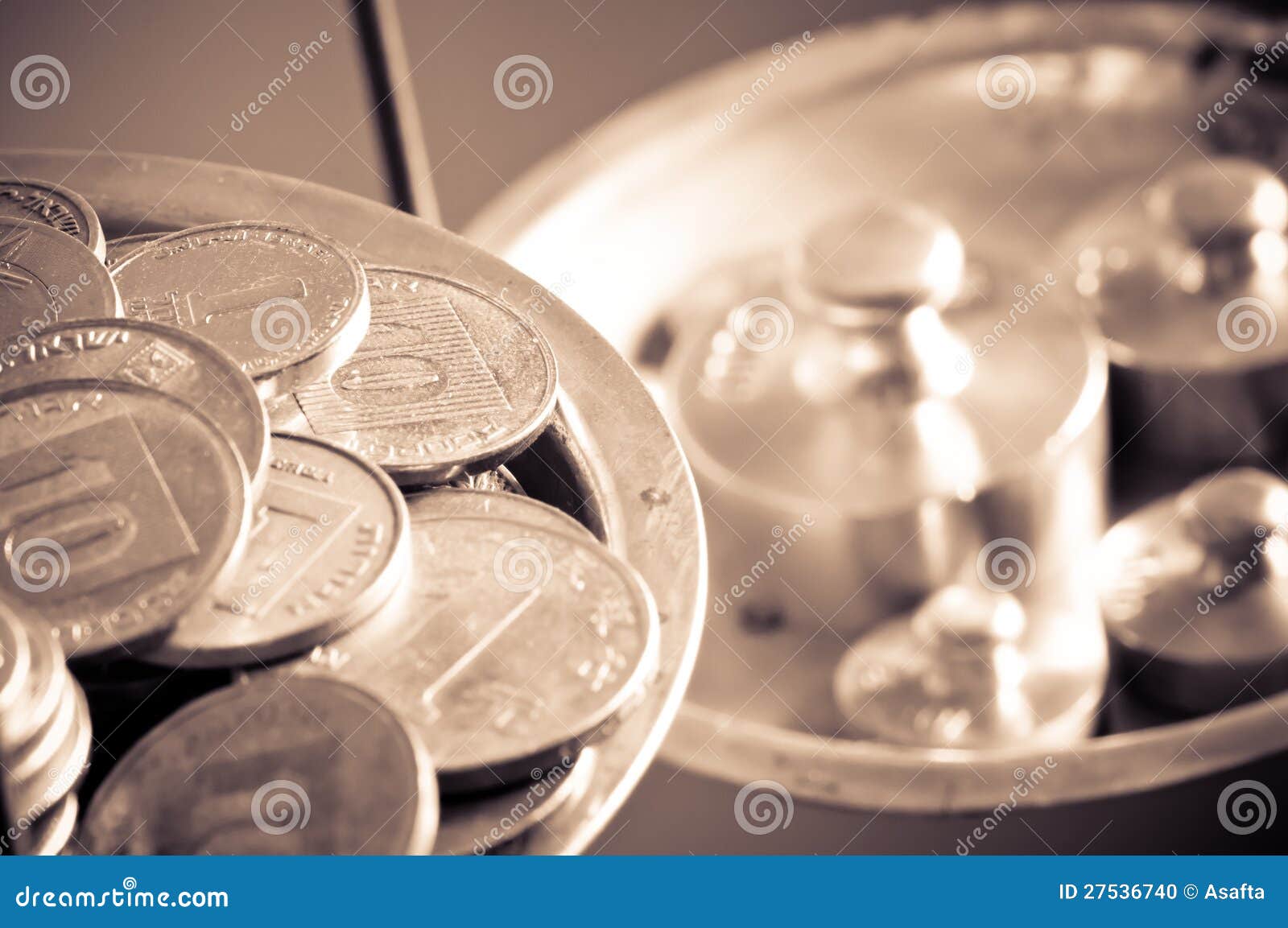 Coins on a scale weight stock photo. Image of heavy, currency - 27536740
