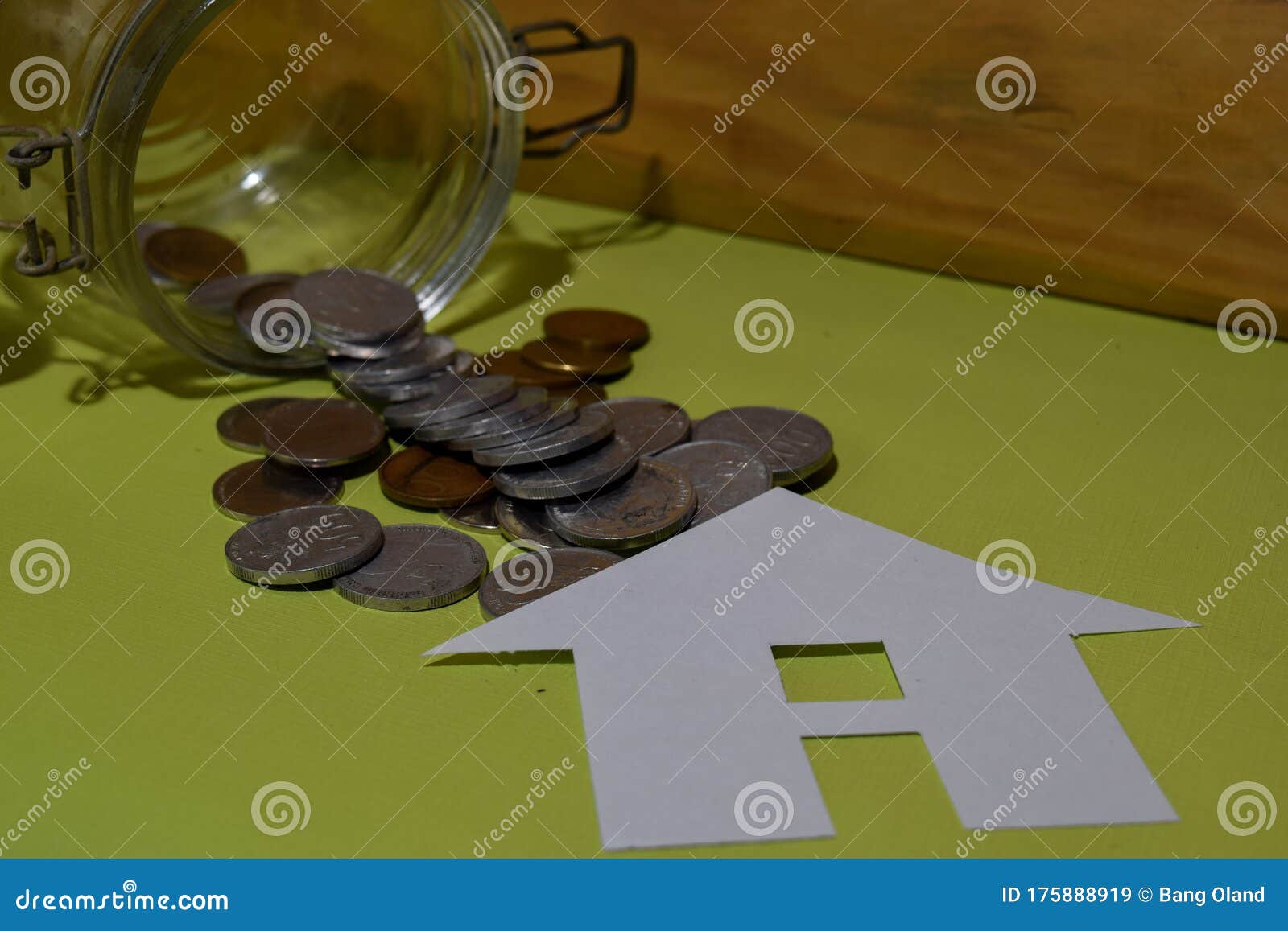 Coins Scattered from Jars and Houses Made of Paper Stock Image - Image ...