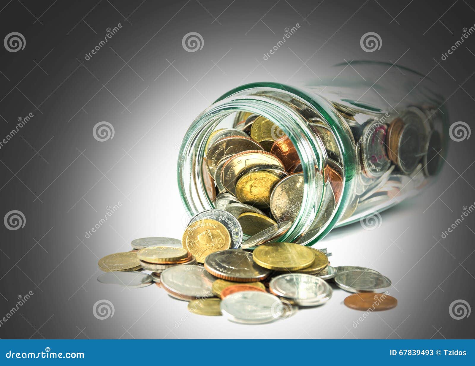 Coins Spilling Out of a Glass Bottle Stock Image - Image of finance ...