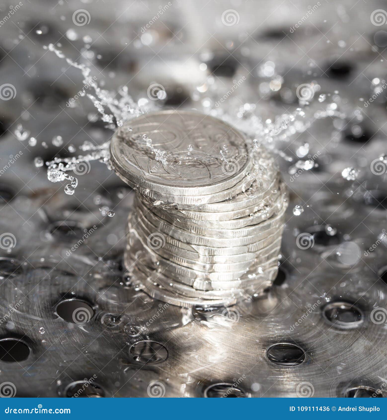 Coins in a spray of water stock photo. Image of gold - 109111436