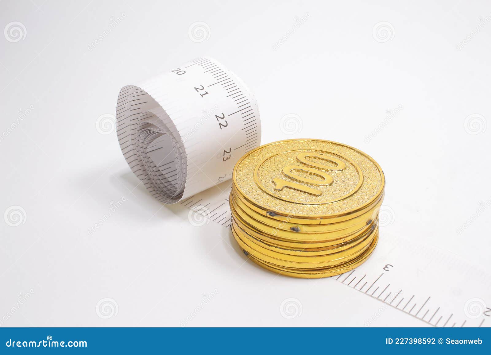 Coins and Tape Measure on the White Back Ground Stock Photo - Image of ...