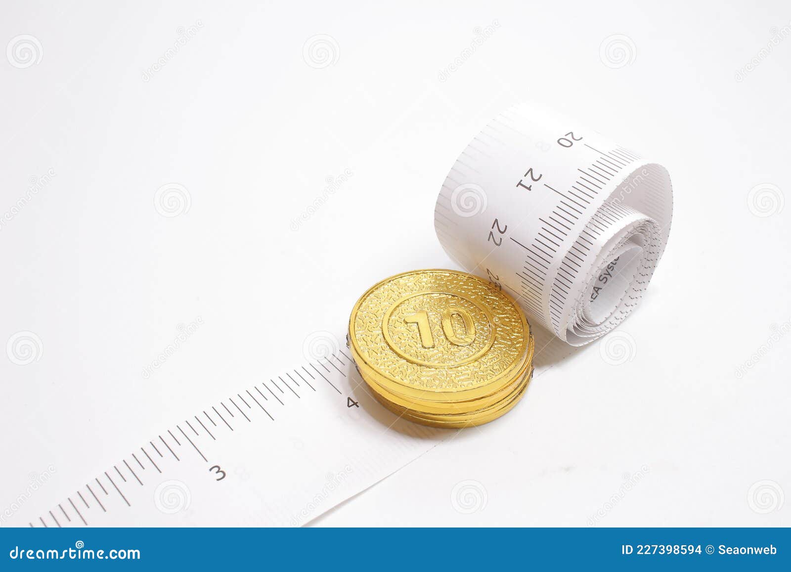 Coins and Tape Measure on the White Back Ground Stock Photo - Image of ...