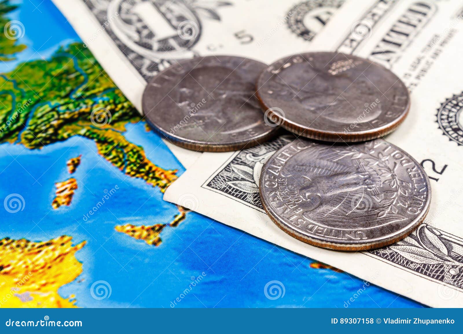 Coins with US Dollars Banknotes on the Background of Geographic Map ...