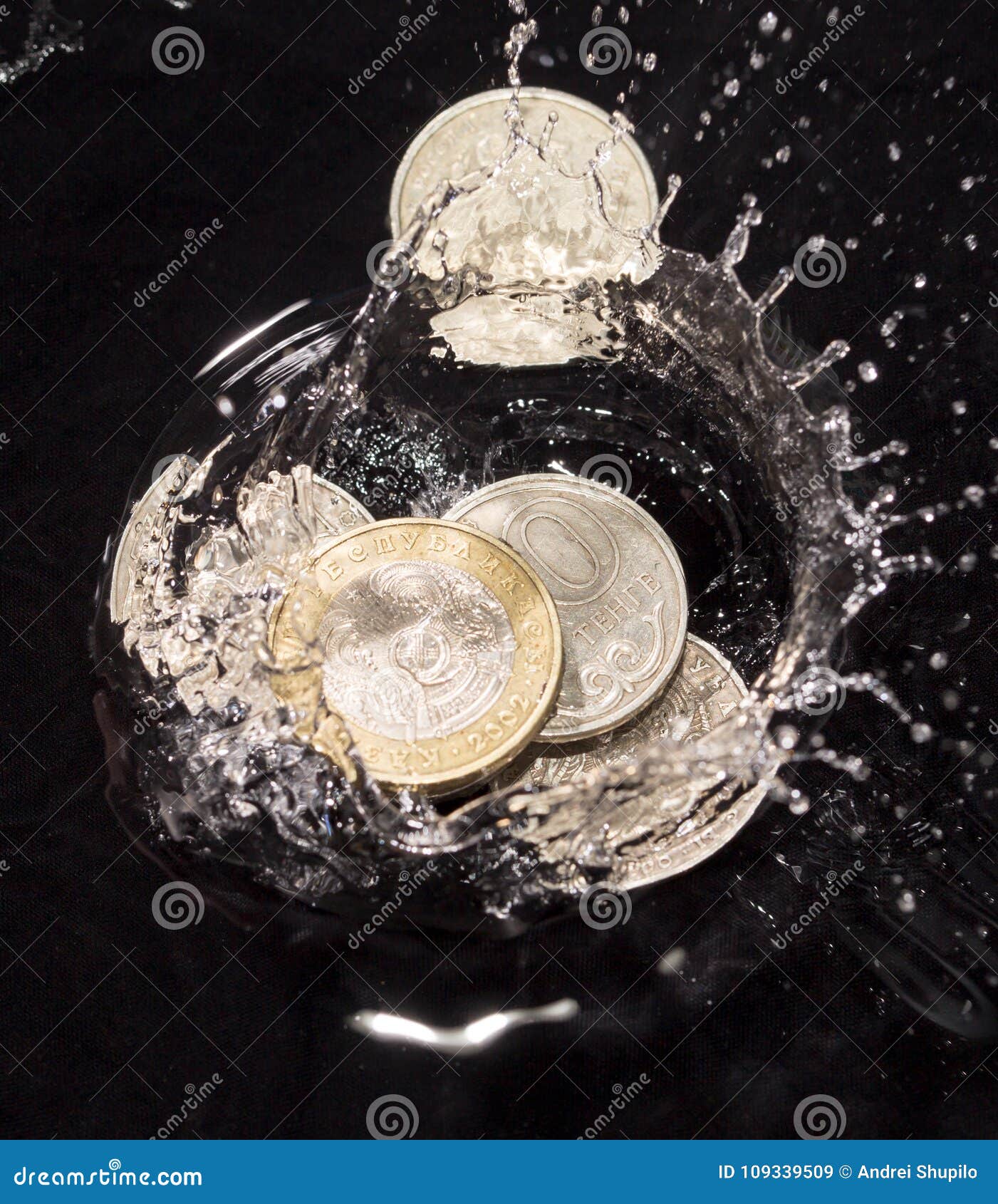 Coins in Water Splashes on a Black Background Stock Image - Image of ...