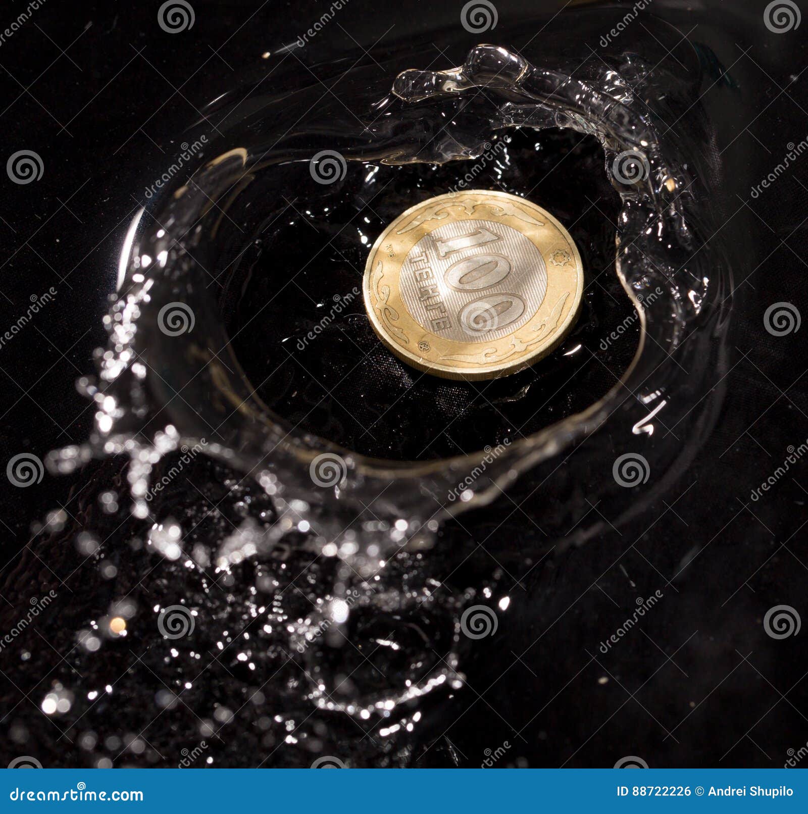 Coins in Water Splashes on a Black Background Stock Photo - Image of ...