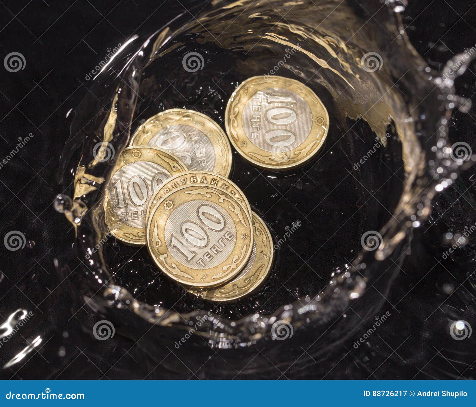 Coins In Water Splashes On A Black Background Royalty-Free Stock ...