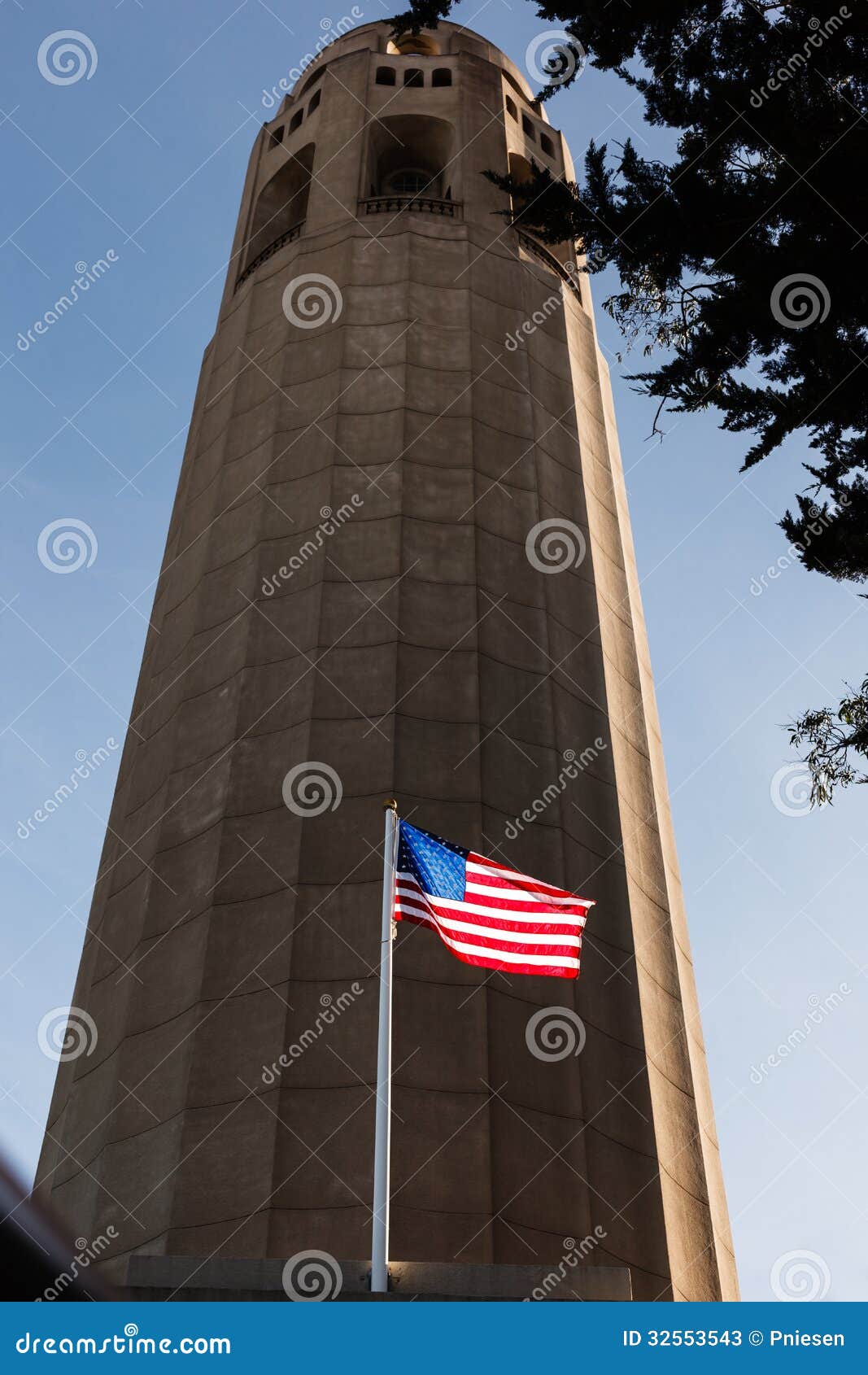 Coit Tower Rises into Blue Sky with American Flag Stock Image - Image ...