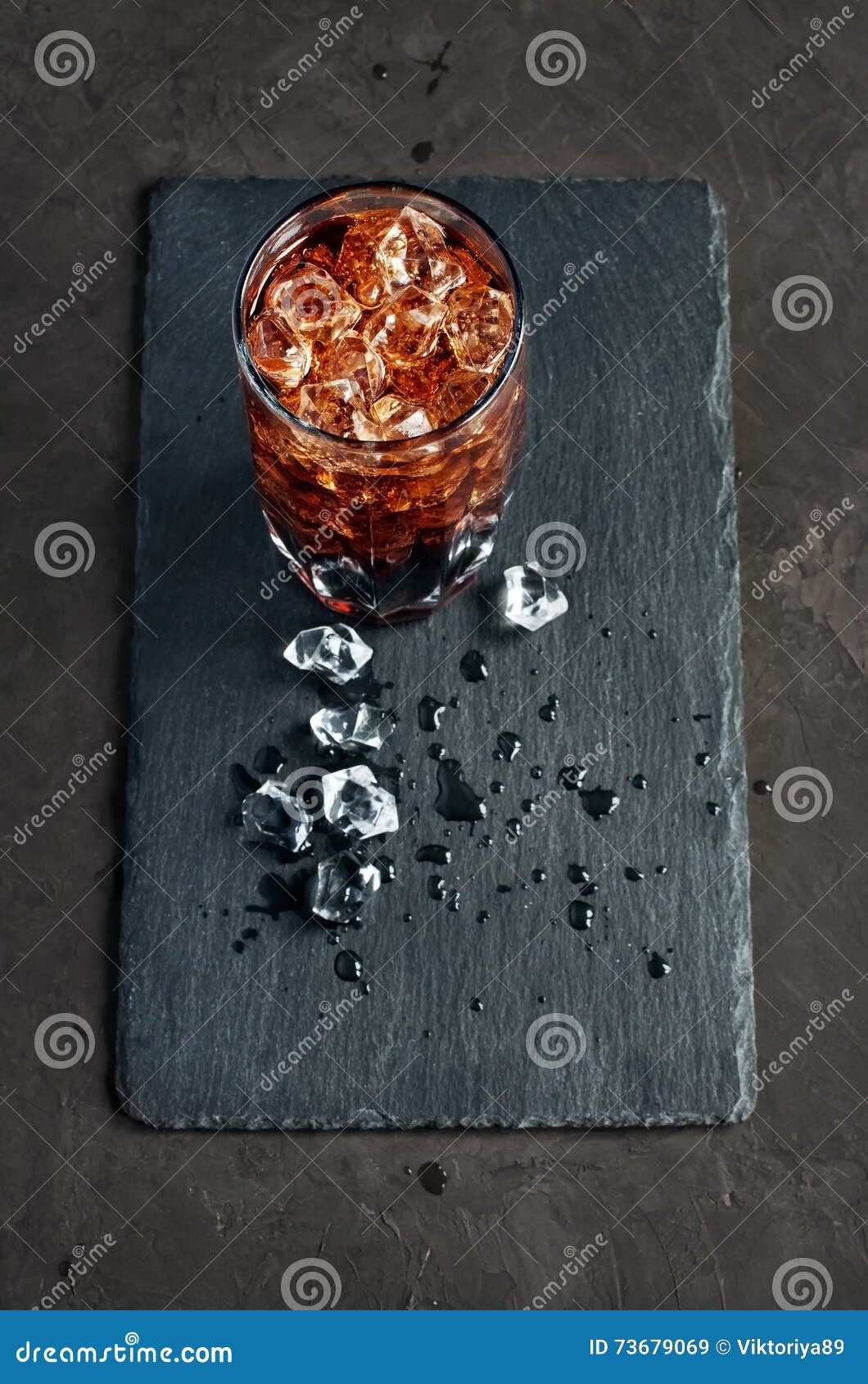 Cola with ice cube stock image. Image of beverage, freshness - 73679069
