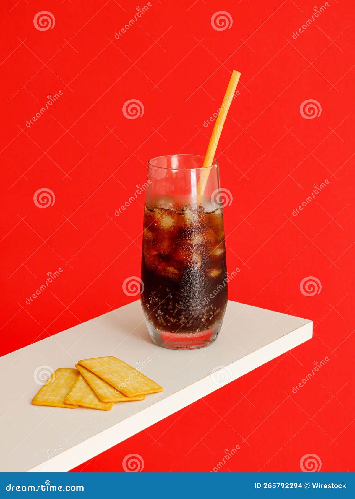 Cold Carbonated Drink with Ice Cubes and Cracker Biscuit Isolated on ...