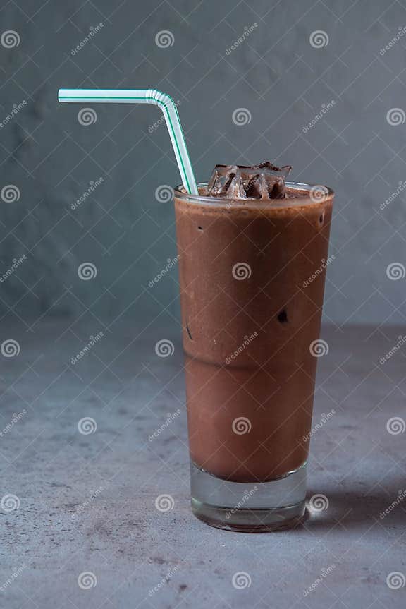 Cold Chocolata Serving in Glass with Straw Side View on Background ...
