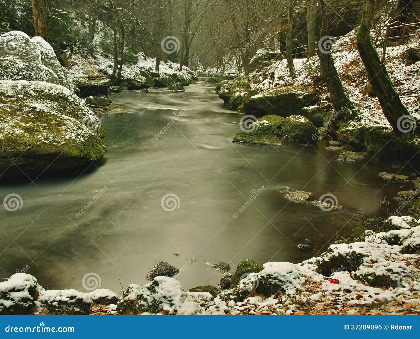 Cold Clear Water of Mountain River in Winter Time, Icicles on Boulder ...