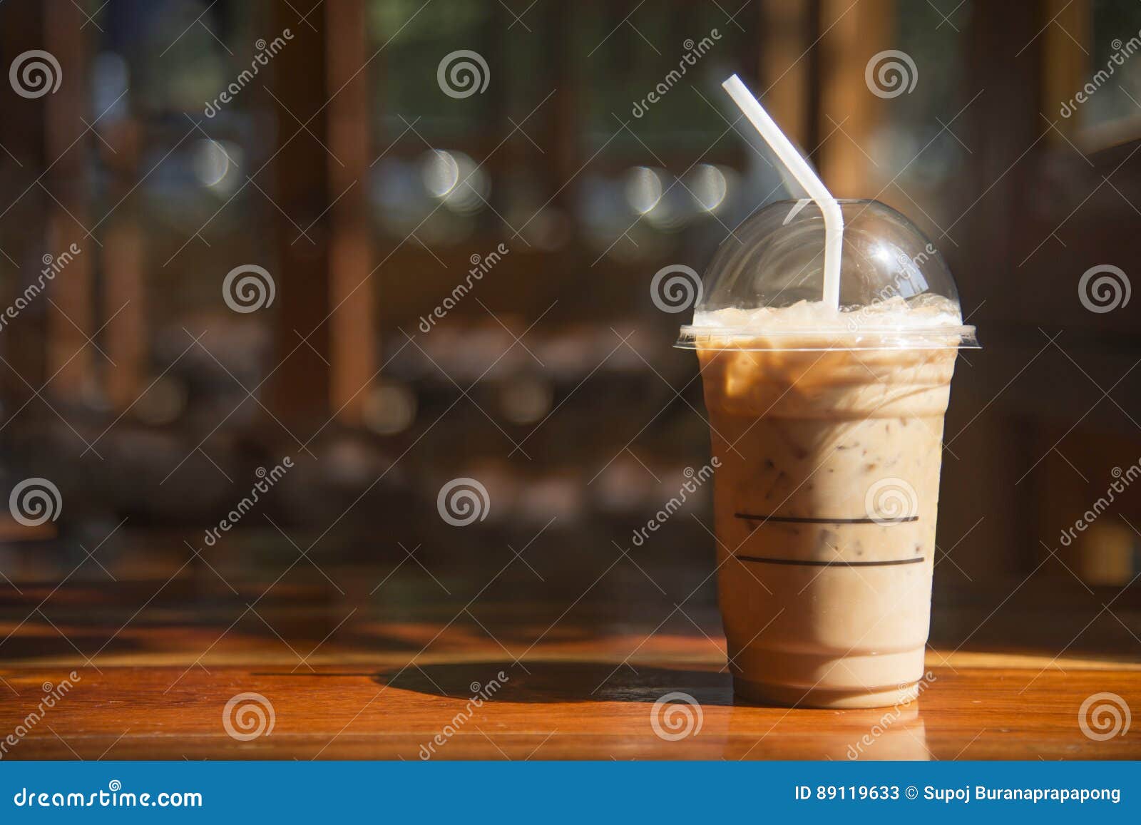 Cold Coffee in Plastic Cup on Brown Wooden Table at Cafe. Stock Image ...