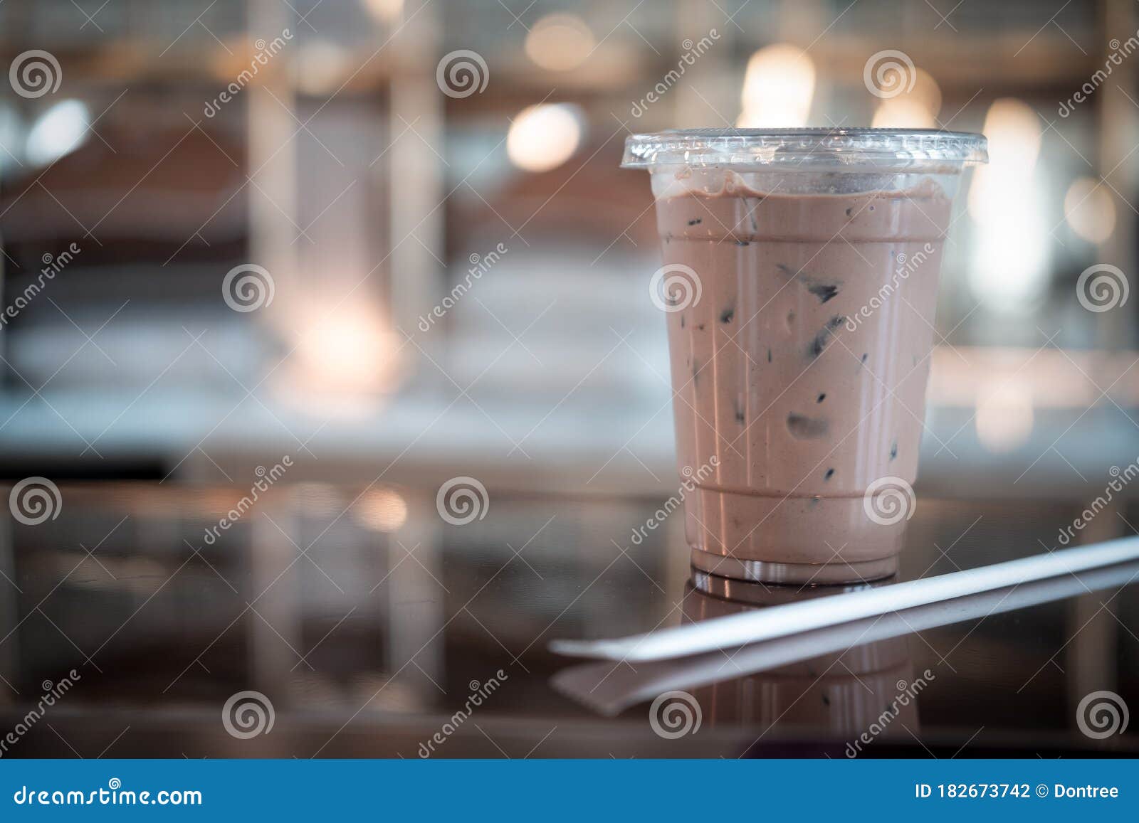 Cold coffee in plastic cup stock photo. Image of glass - 182673742