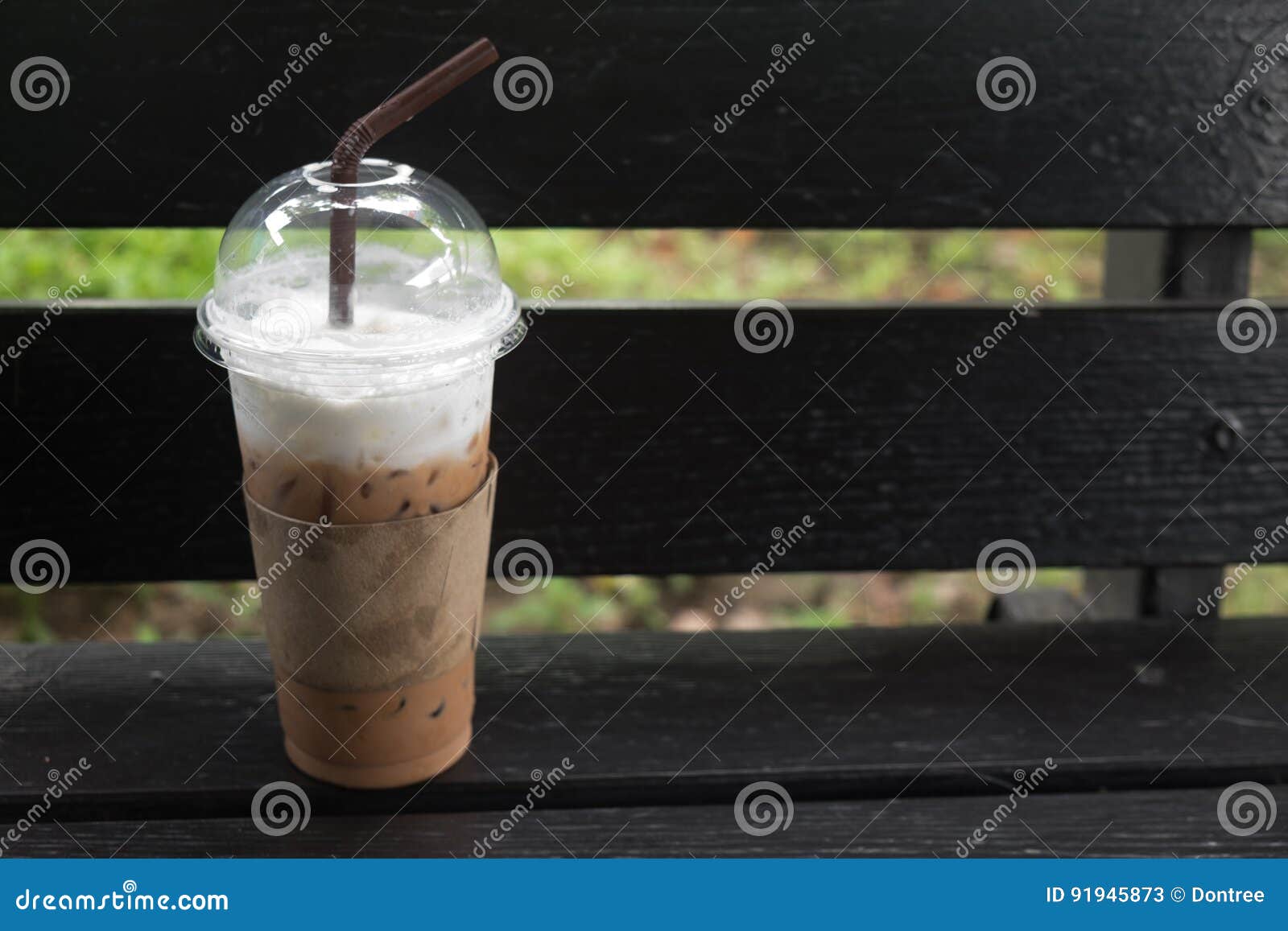 Cold Coffee in Plastic Cup on a Wooden Table Stock Image - Image of ...