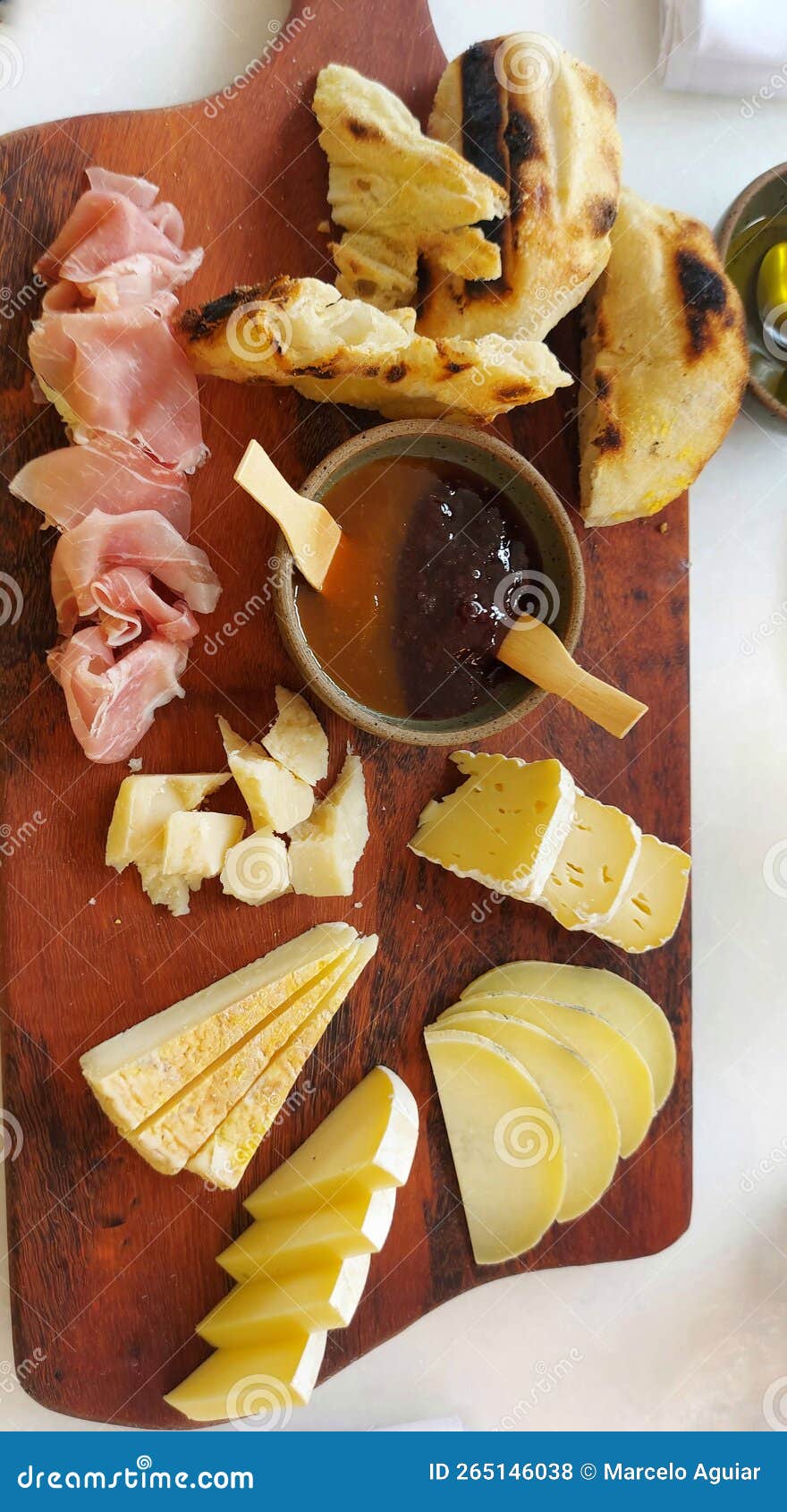 Cold Cuts Board with a Variety of Cheeses, Ham and Pepper Jam Stock ...