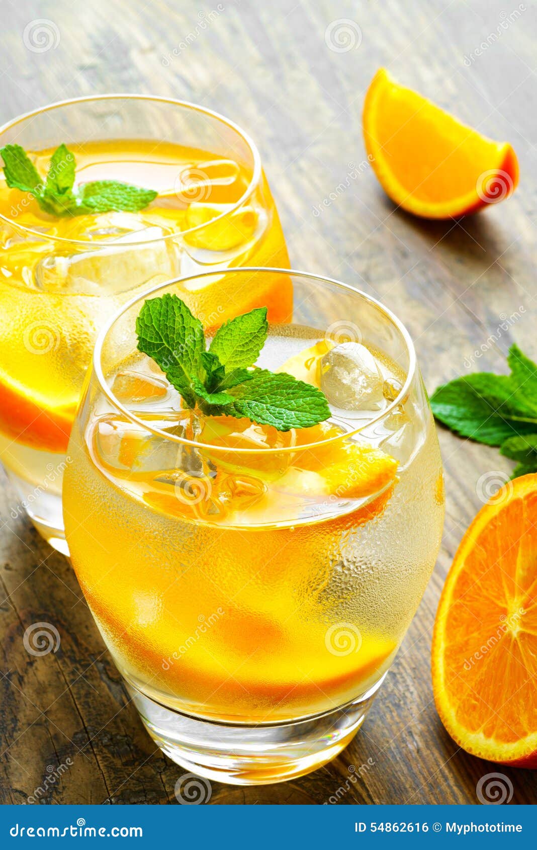Cold Drinks with Ice and Mint. Orange Cocktail on Stock Photo - Image ...