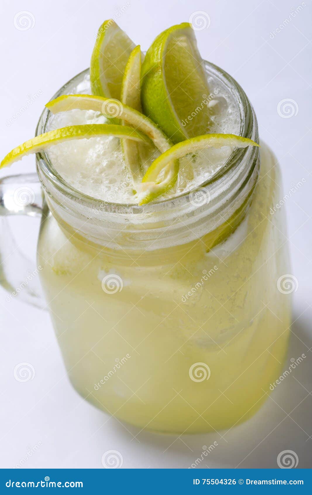Cold Fresh Lemonade Drink with Lime on a White Background, Close Stock ...