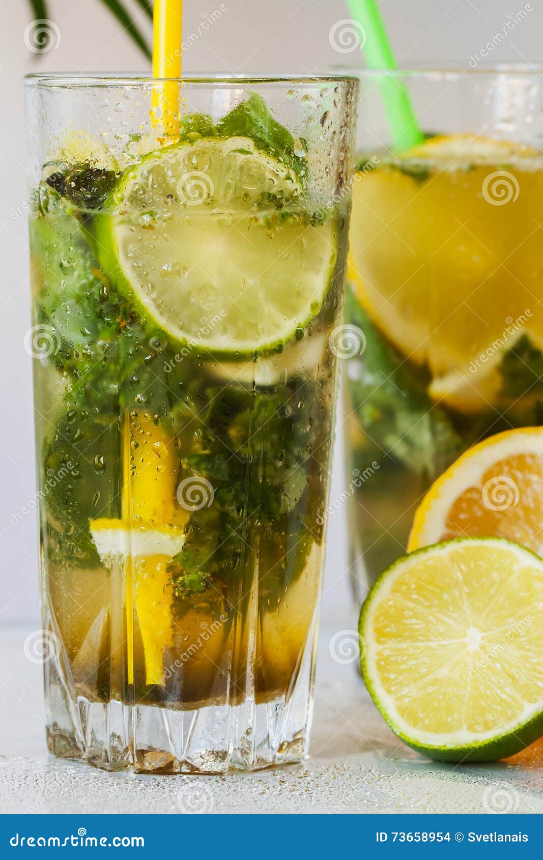 Cold Fresh Lemonade with Ice, Lime and Lemon Stock Photo - Image of ...