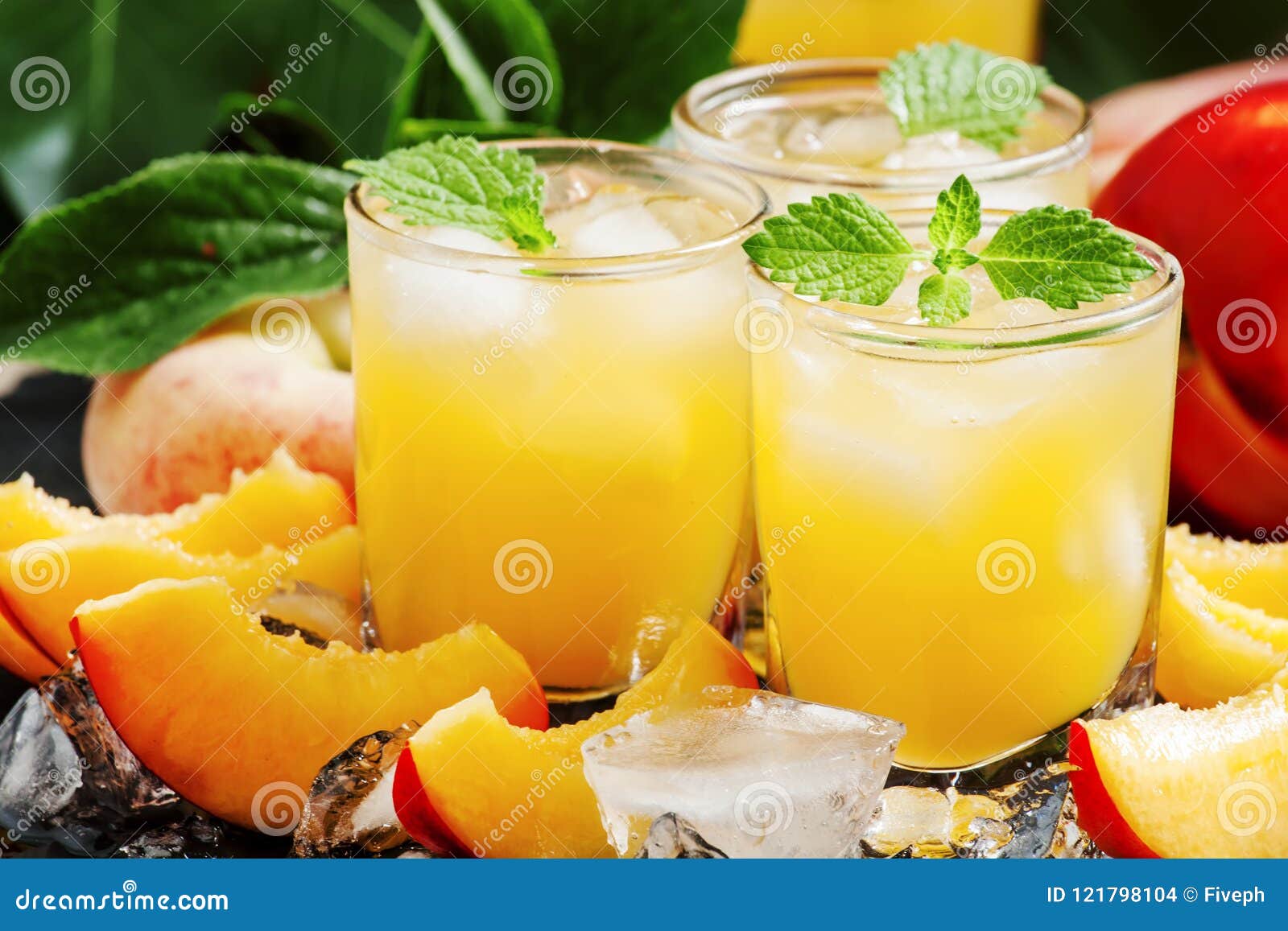 Cold Fresh Peach Nectar with Pulp, Ice and Mint, Selective Focus Stock ...