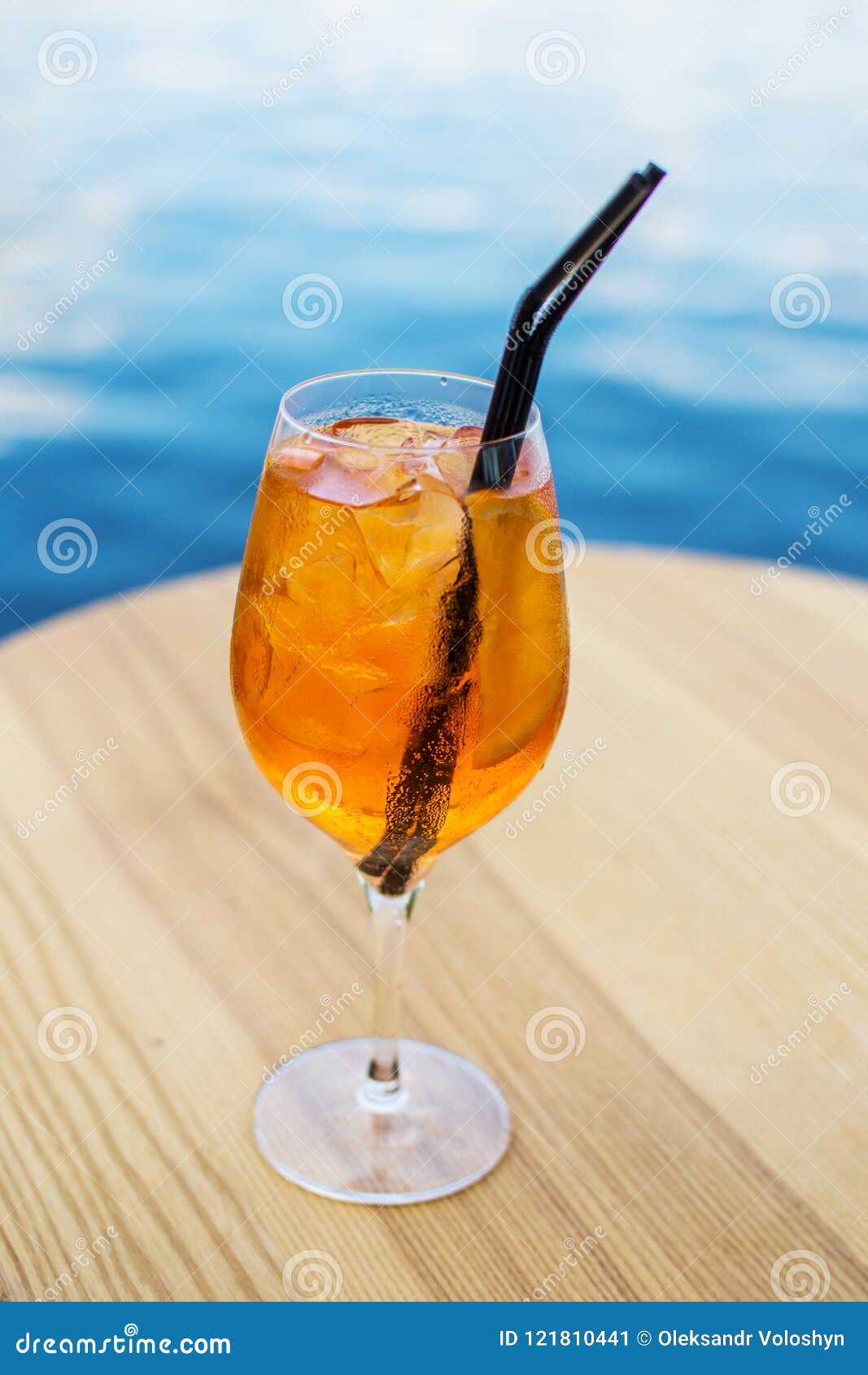 Cold Glass of Aperol Spritz Appetizer Stand on Table Near the River ...