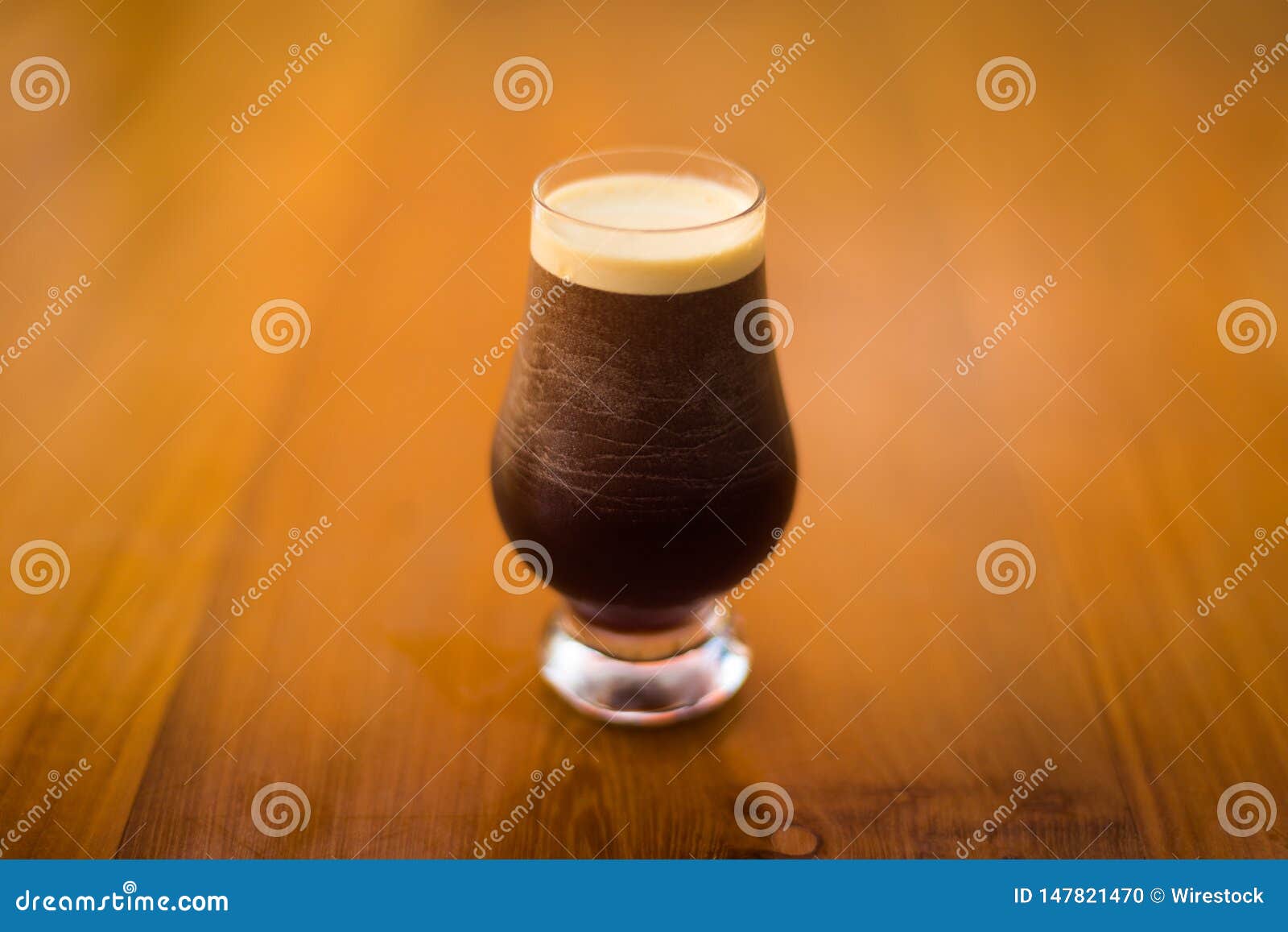 A Cold Glass of Dark Beer on a Wooden Surface Stock Photo - Image of ...