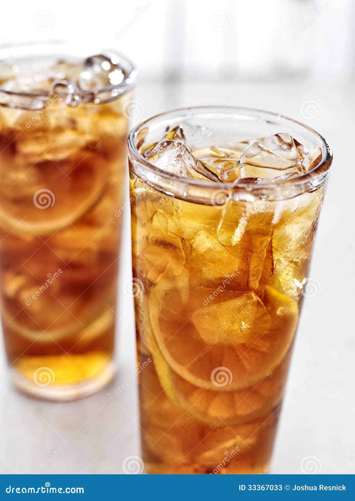 Cold iced tea with lemons. stock image. Image of reflection - 33367033