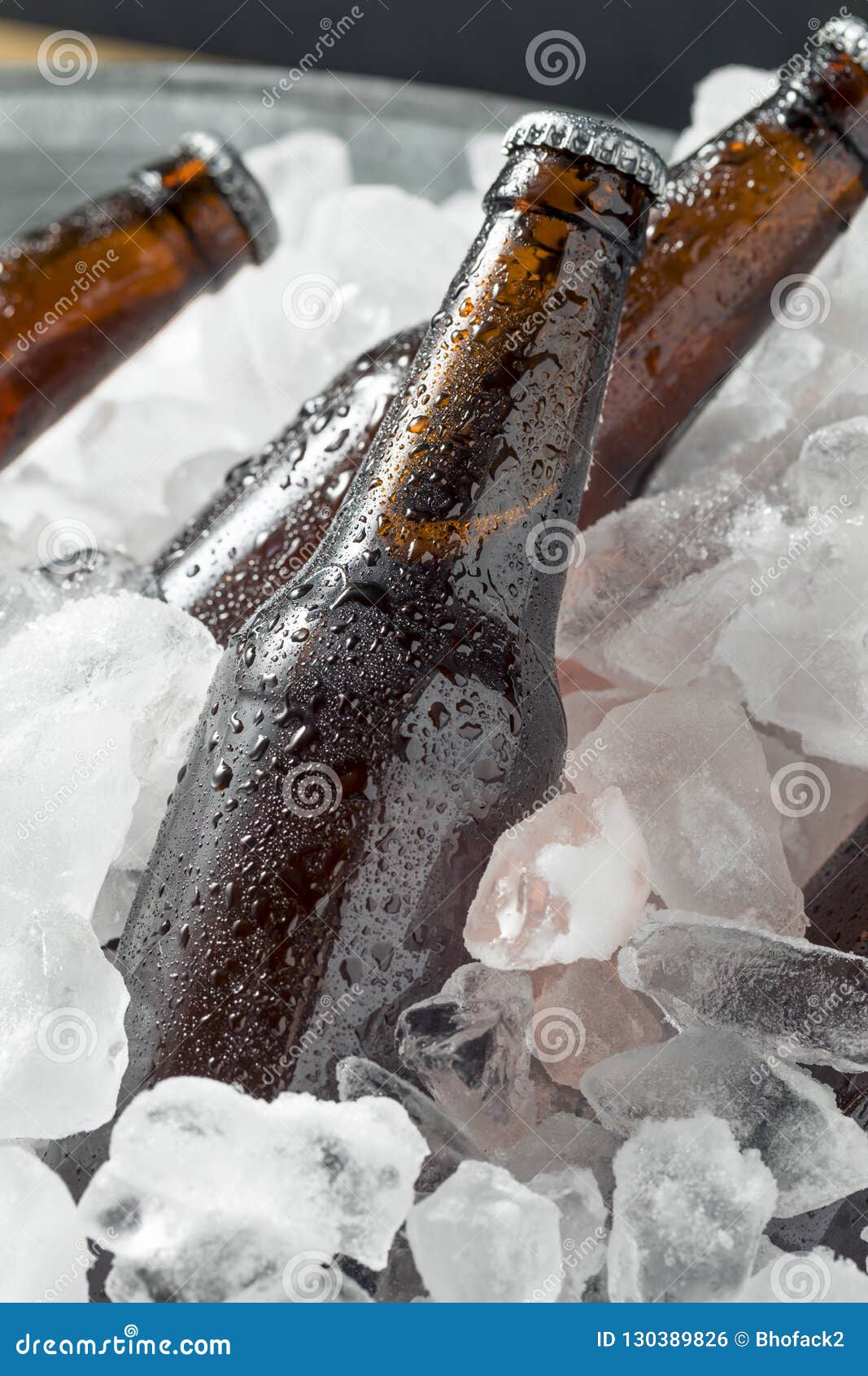 Cold Icy Beer Bottles stock photo. Image of liquid, full - 130389826