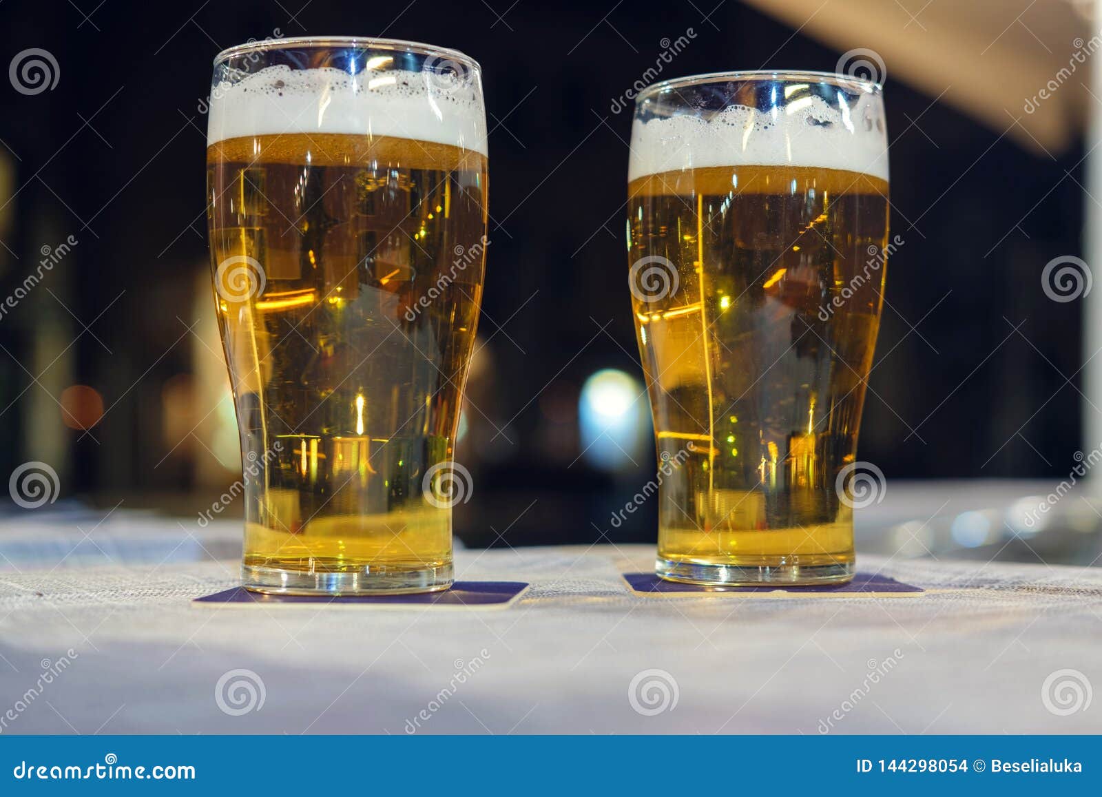 Cold light beer glasses stock photo. Image of drink - 144298054